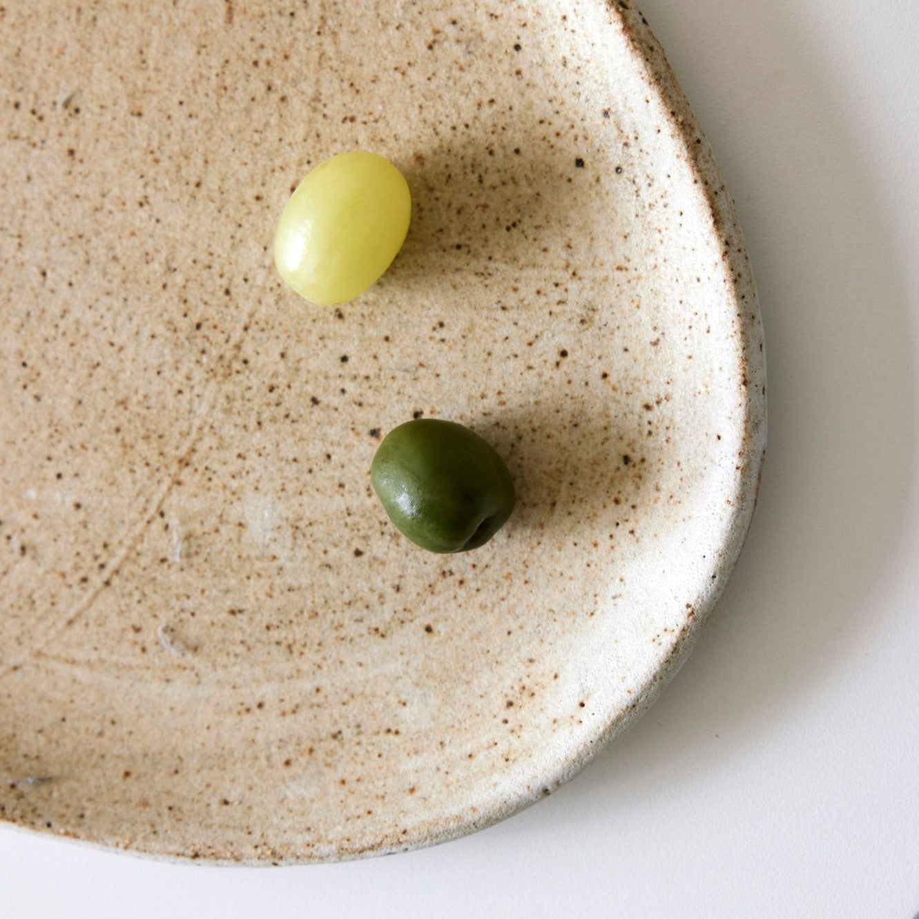 A Grape and a Olive were found in the bathroom. Olive Oil should ONLY ...